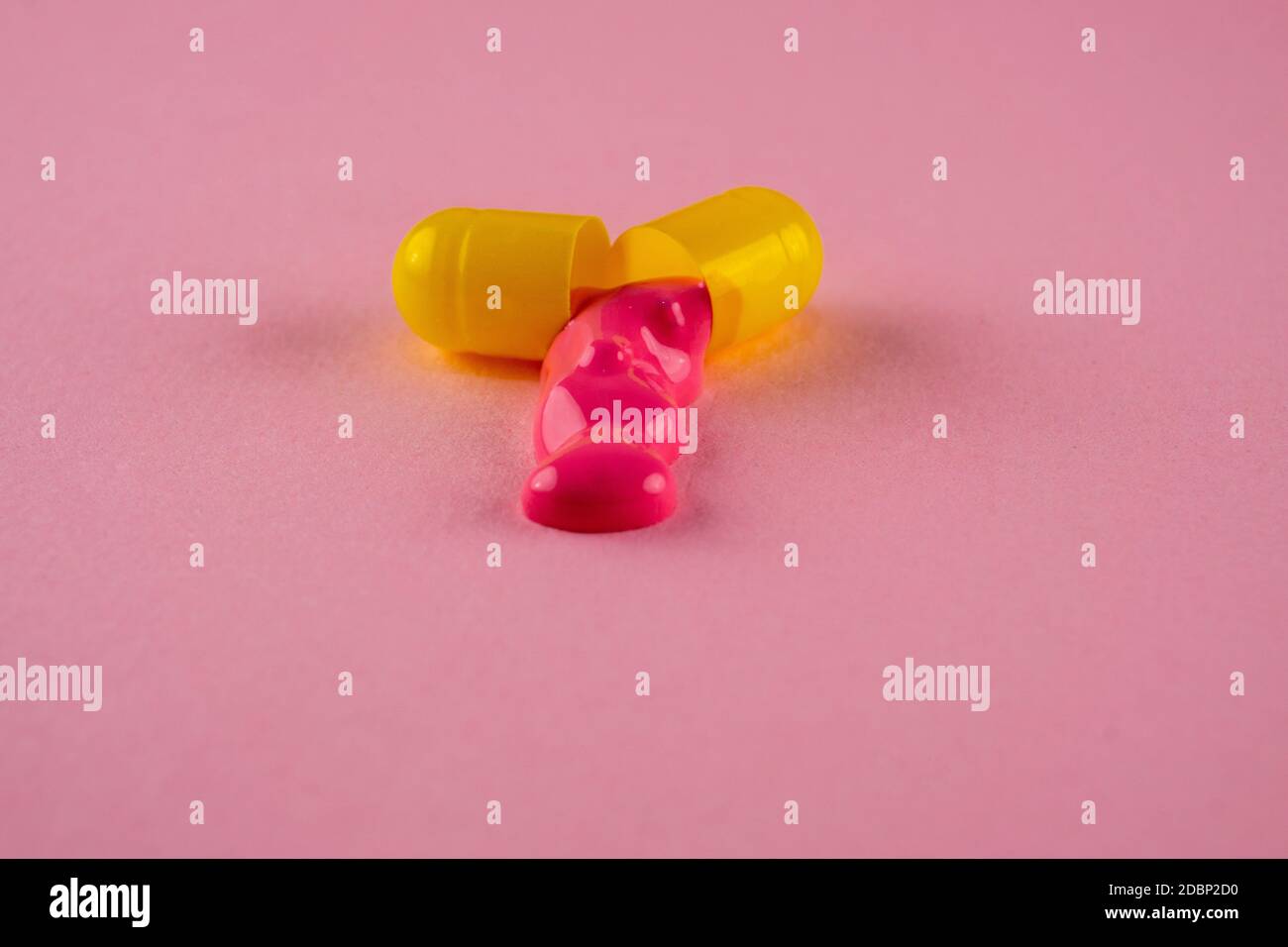 Creative layout of open pill with dripping paint. Macro shot Stock ...