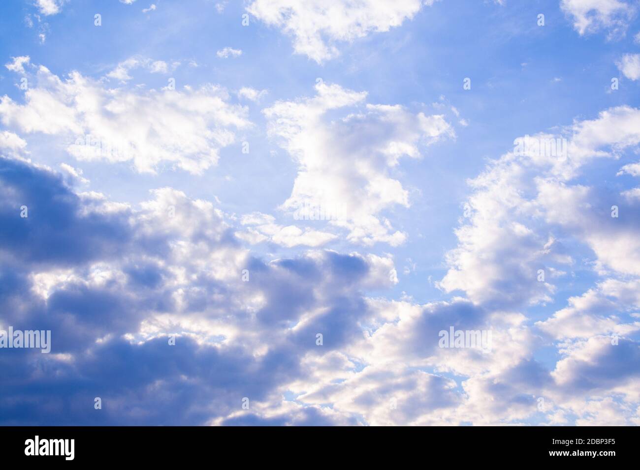 White clouds high in the sky at windy winter day background Stock Photo ...