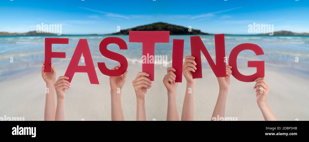 People Hands Holding Red English Word Fasting. Ocean And Beach As ...