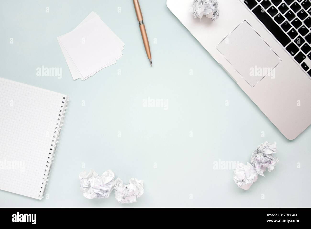 Work and creativity concept. Laptop, notepad, crumpled paper and pen ...