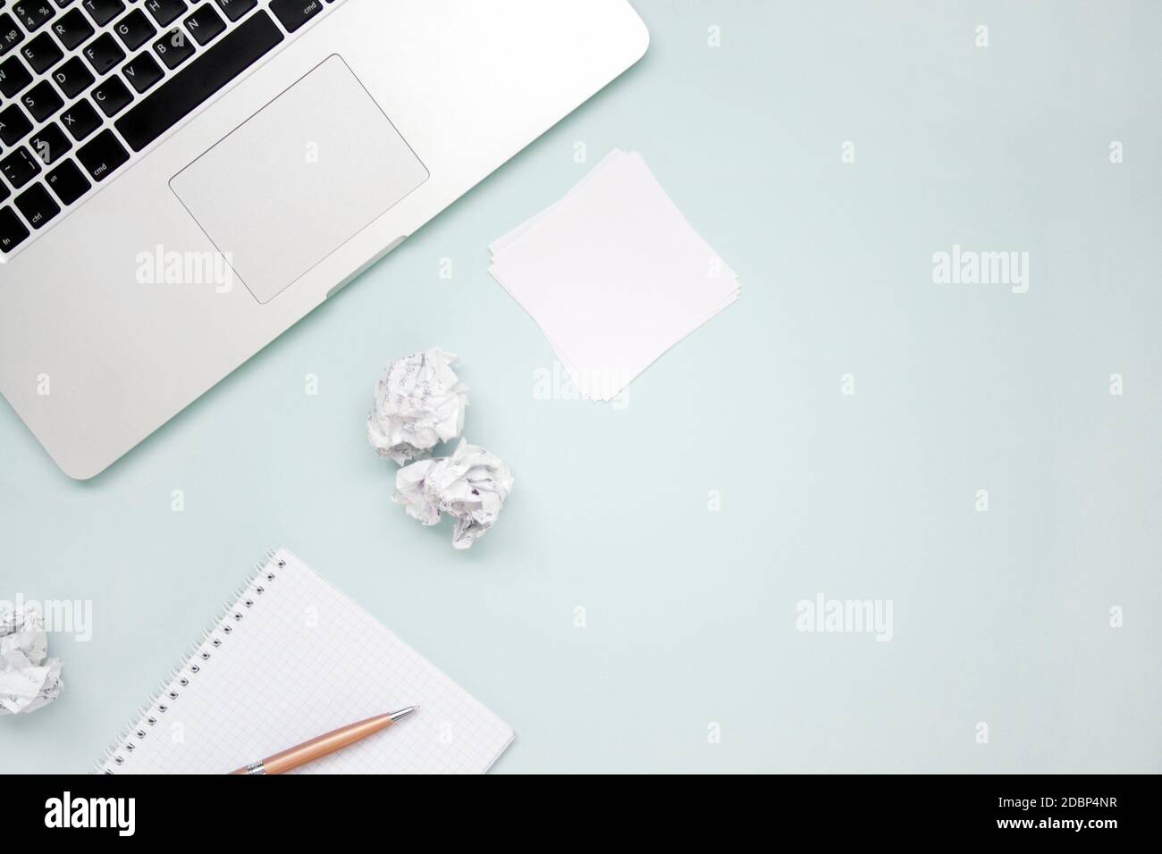 Work and creativity concept. Laptop, notepad, crumpled paper and pen ...