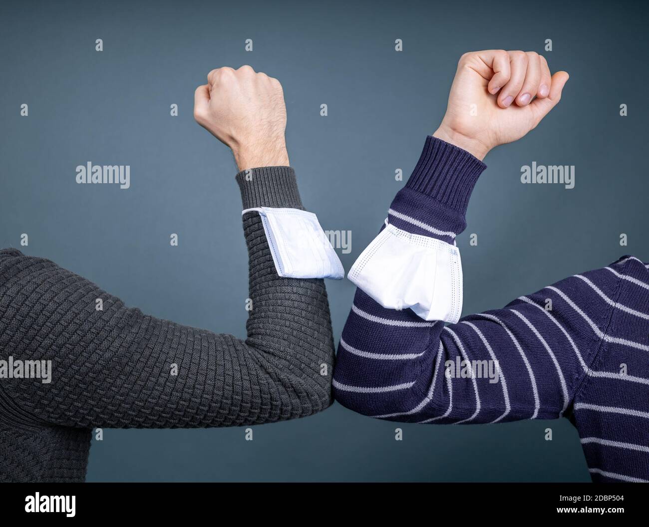 Friends bumping elbows distance greeting hi-res stock photography and ...