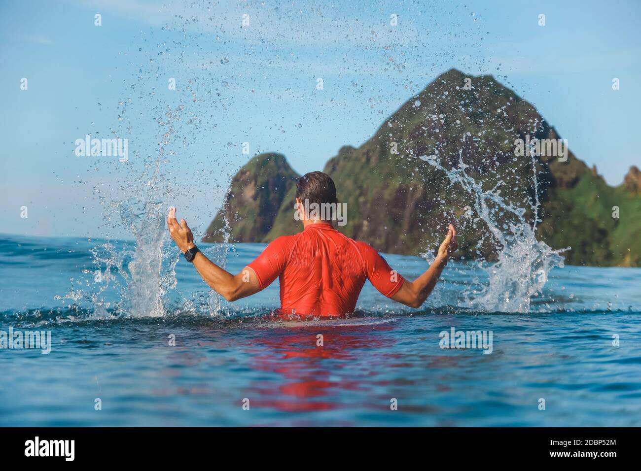 Man splashing in sea, Sumbawa, Indonesia Stock Photo - Alamy