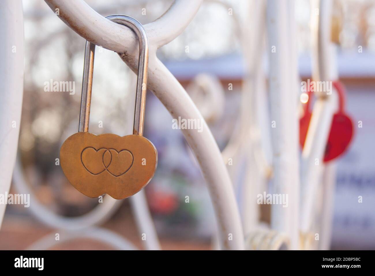 Golden heart lock , valentine love symbol. Golden Heart Lock hanging on ...