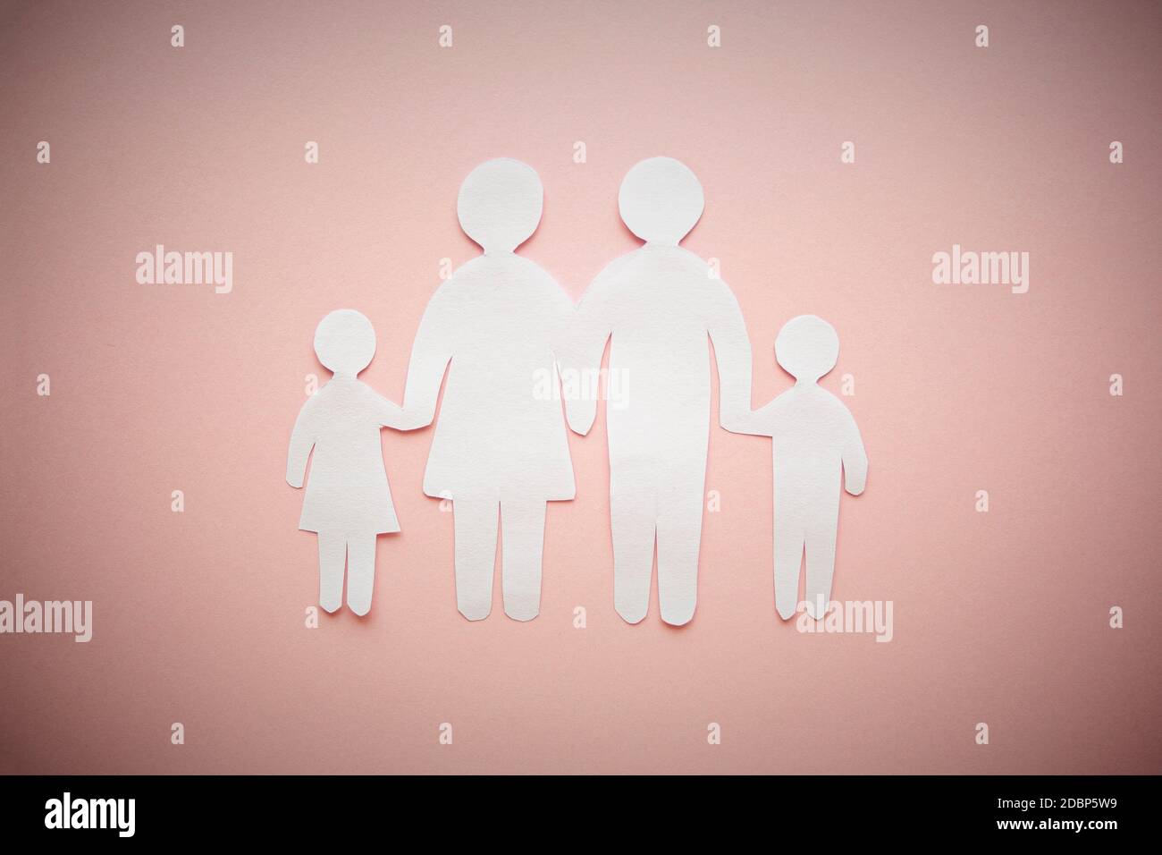 paper family cut out on bright pink background, family home, foster ...