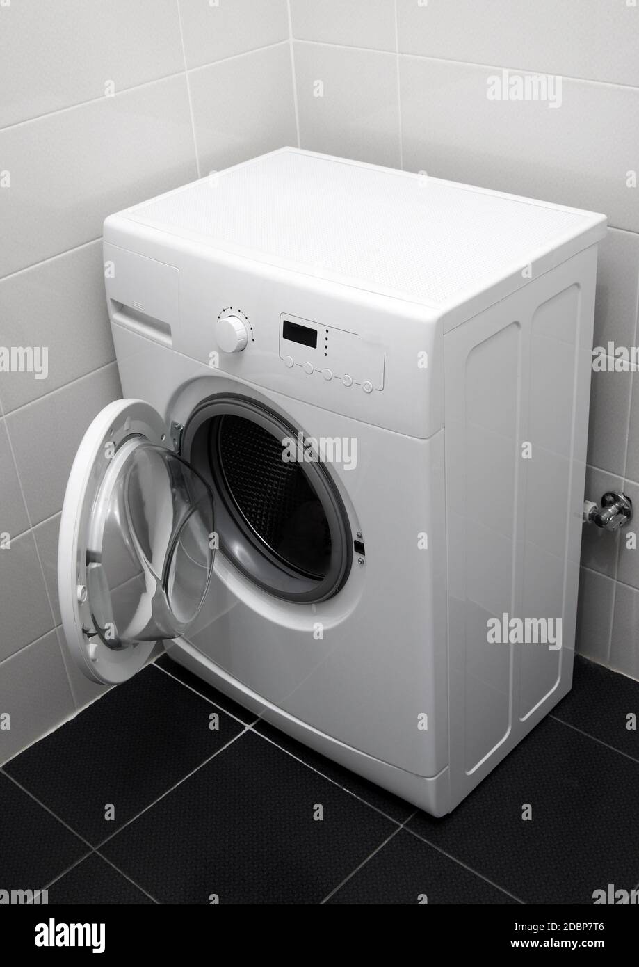 washing machine in the bathroom Stock Photo - Alamy