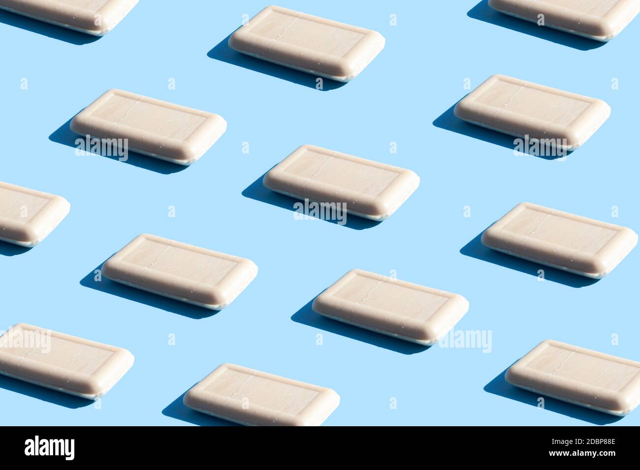 Pattern of pieces of solid soap on a blue background with trendy ...