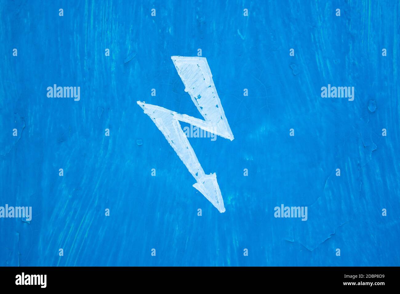 White sign danger electricity on steel blue painted wall in switchboard ...