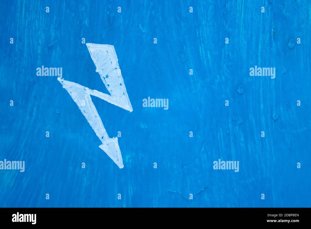 White sign danger electricity on steel blue painted wall in switchboard ...