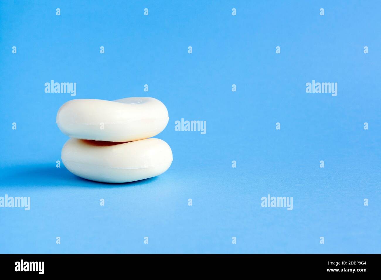Soap side view on a blue background with trendy soft light. Wash your ...