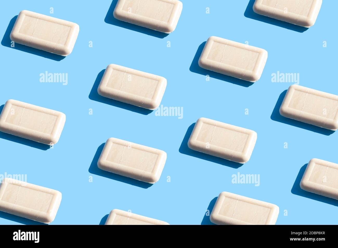 Pattern of pieces of solid soap on a blue background with trendy ...