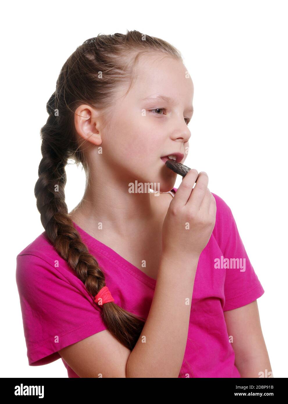pretty girl eating chocolate bisquit Stock Photo - Alamy