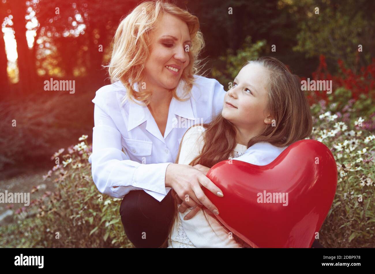 mother and daughter in the autumn park with baloons Stock Photo - Alamy