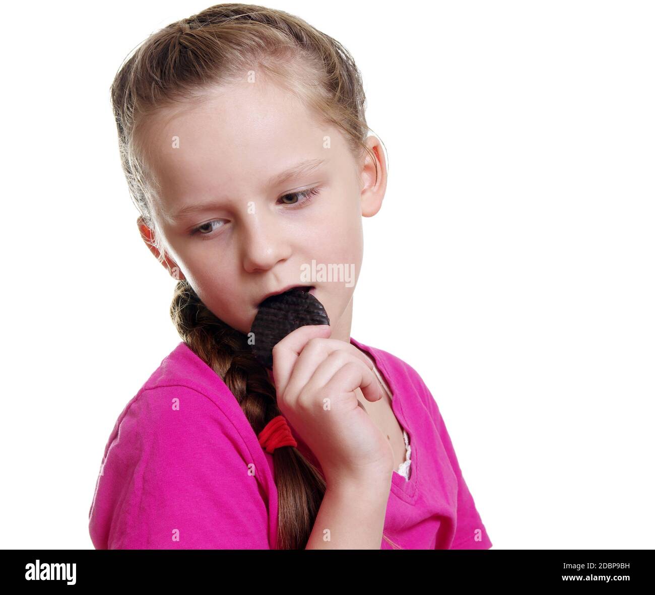 pretty girl eating chocolate bisquit Stock Photo - Alamy