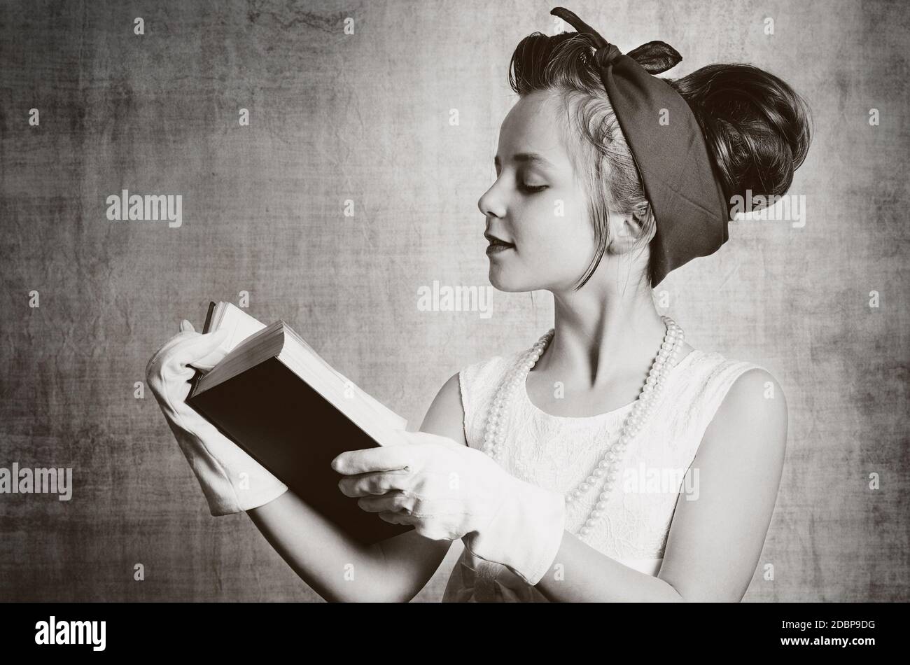 pretty girl with book portrait,retro style Stock Photo - Alamy