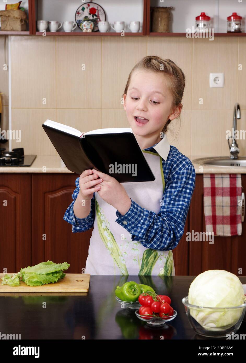 little girl is helping to cook in a kitchen with different ingredients ...