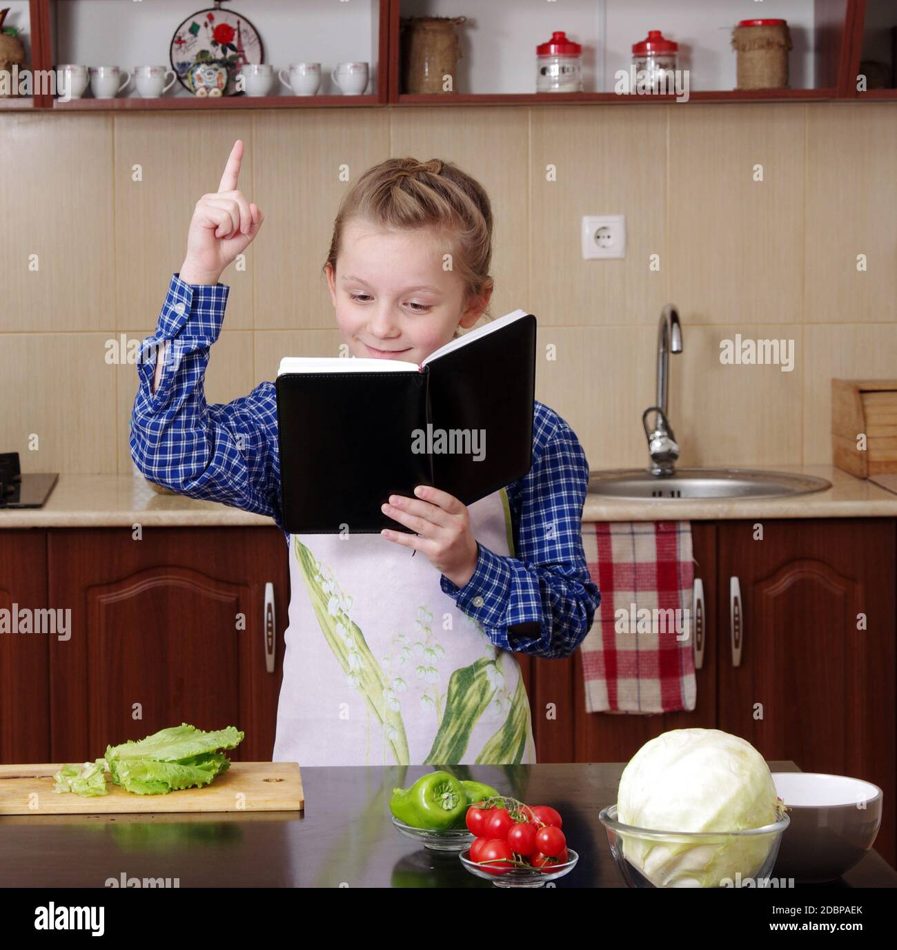 little girl is helping to cook in a kitchen with different ingredients ...