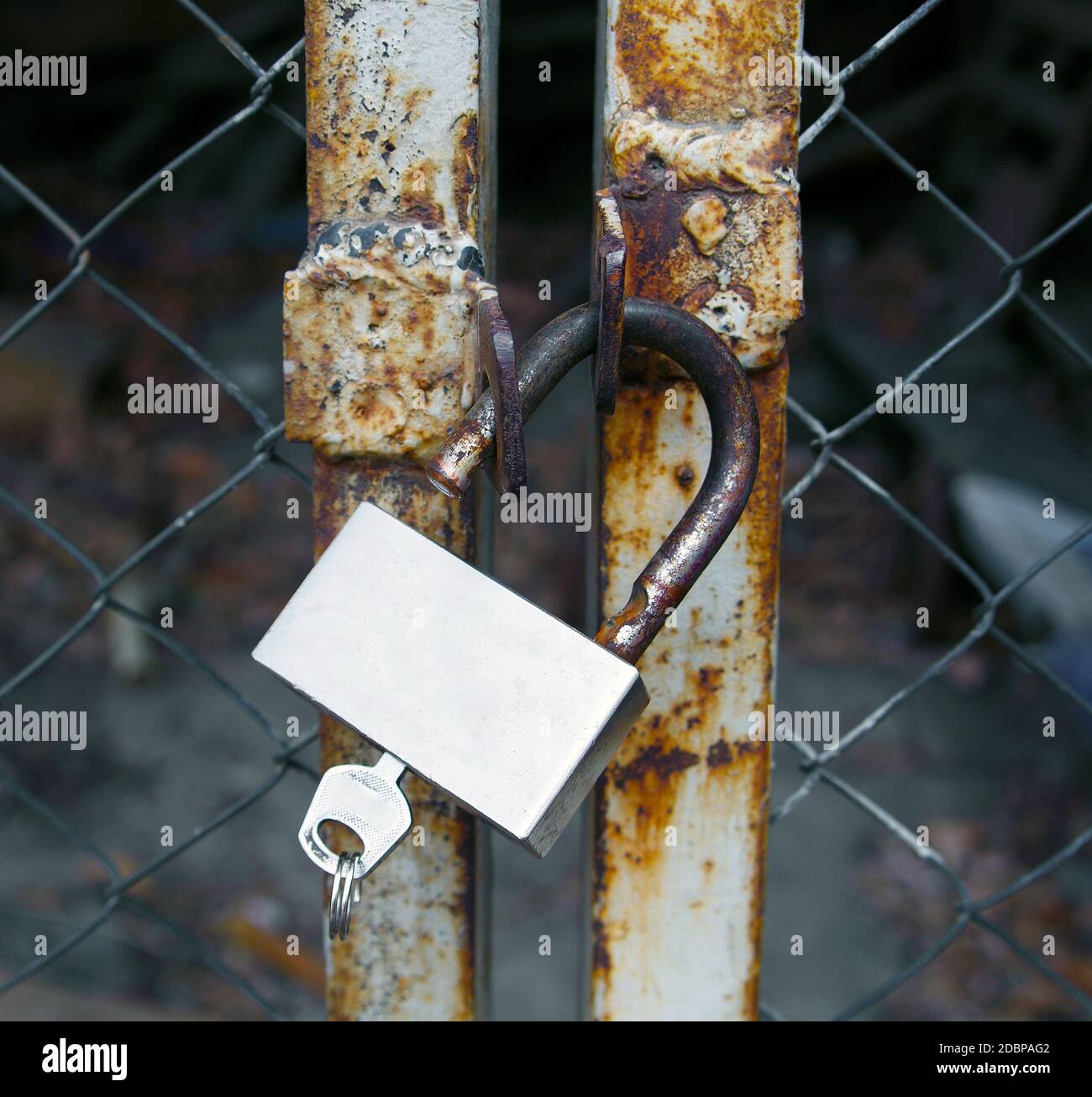 old rustic steel lock on gate Stock Photo - Alamy