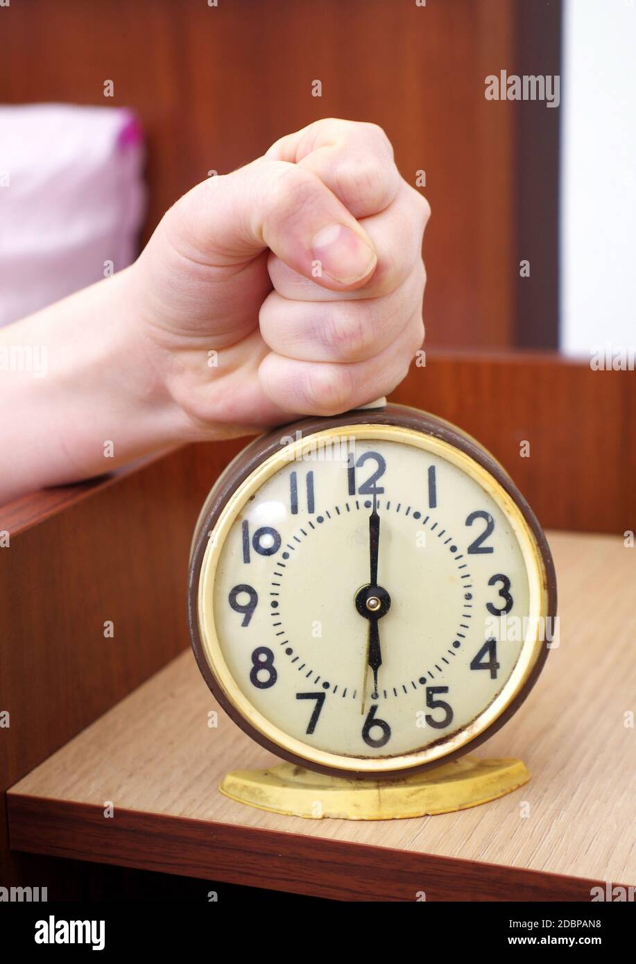 stopping the alarm clock in the bedroom Stock Photo - Alamy