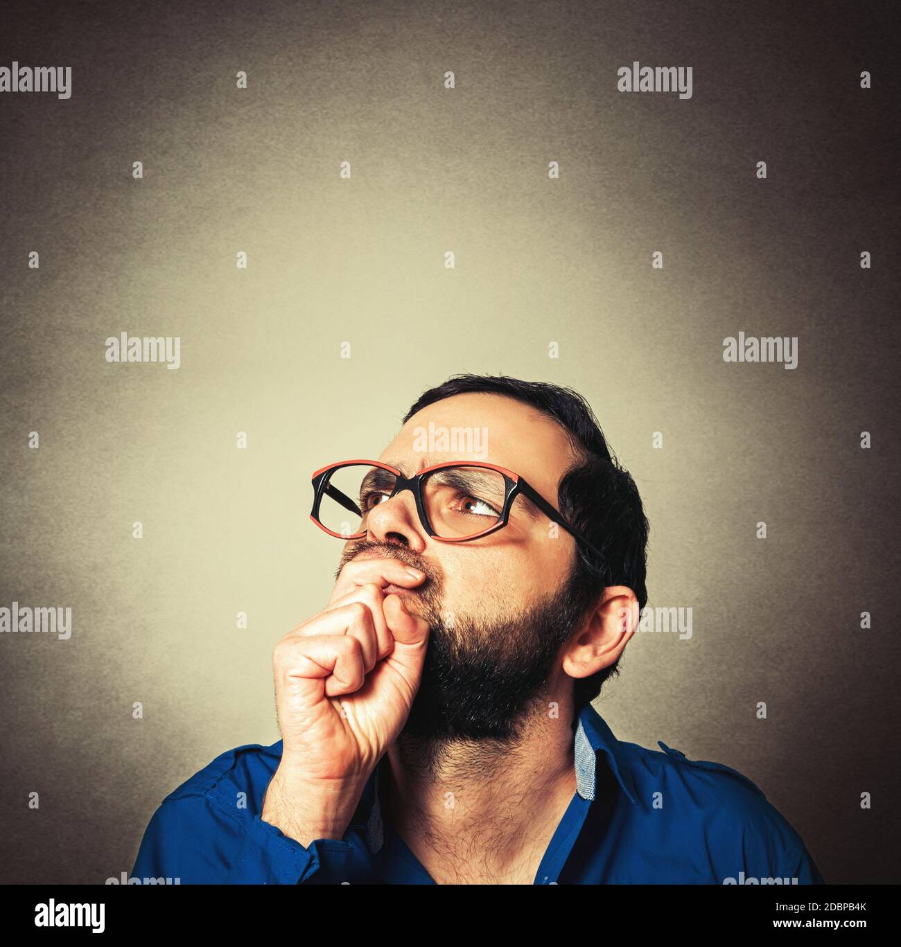 casual man with the beard thinking Stock Photo - Alamy