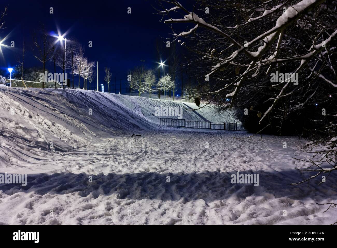 Snow covered roads in a small town at night Stock Photo - Alamy