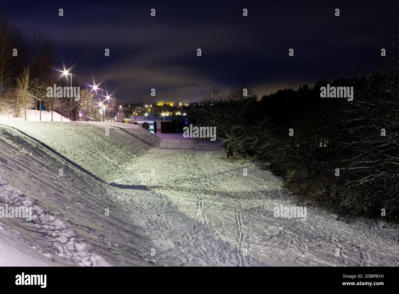 Snow covered roads in a small town at night Stock Photo - Alamy