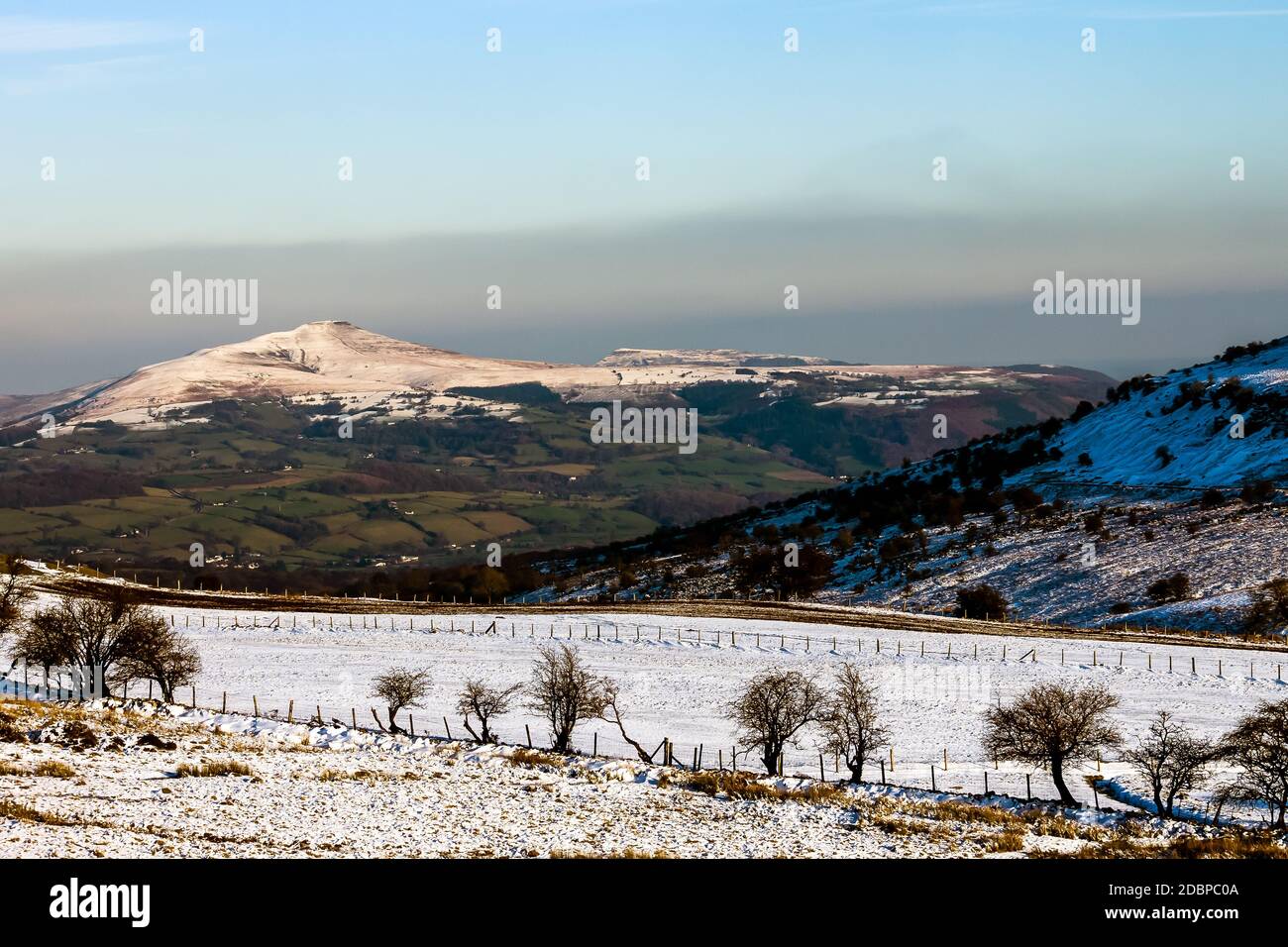 A clear snowline on higher hills in the middle of winter in Wales Stock ...
