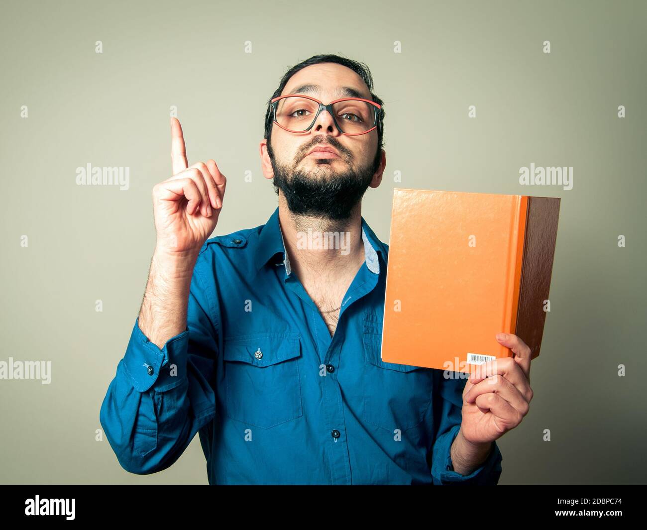 geek with the beard reading Stock Photo - Alamy