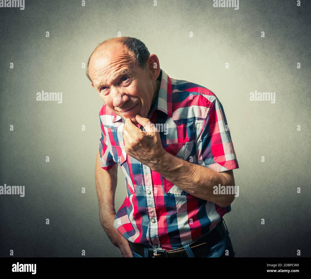 portrait of the funny senior man thinking Stock Photo - Alamy