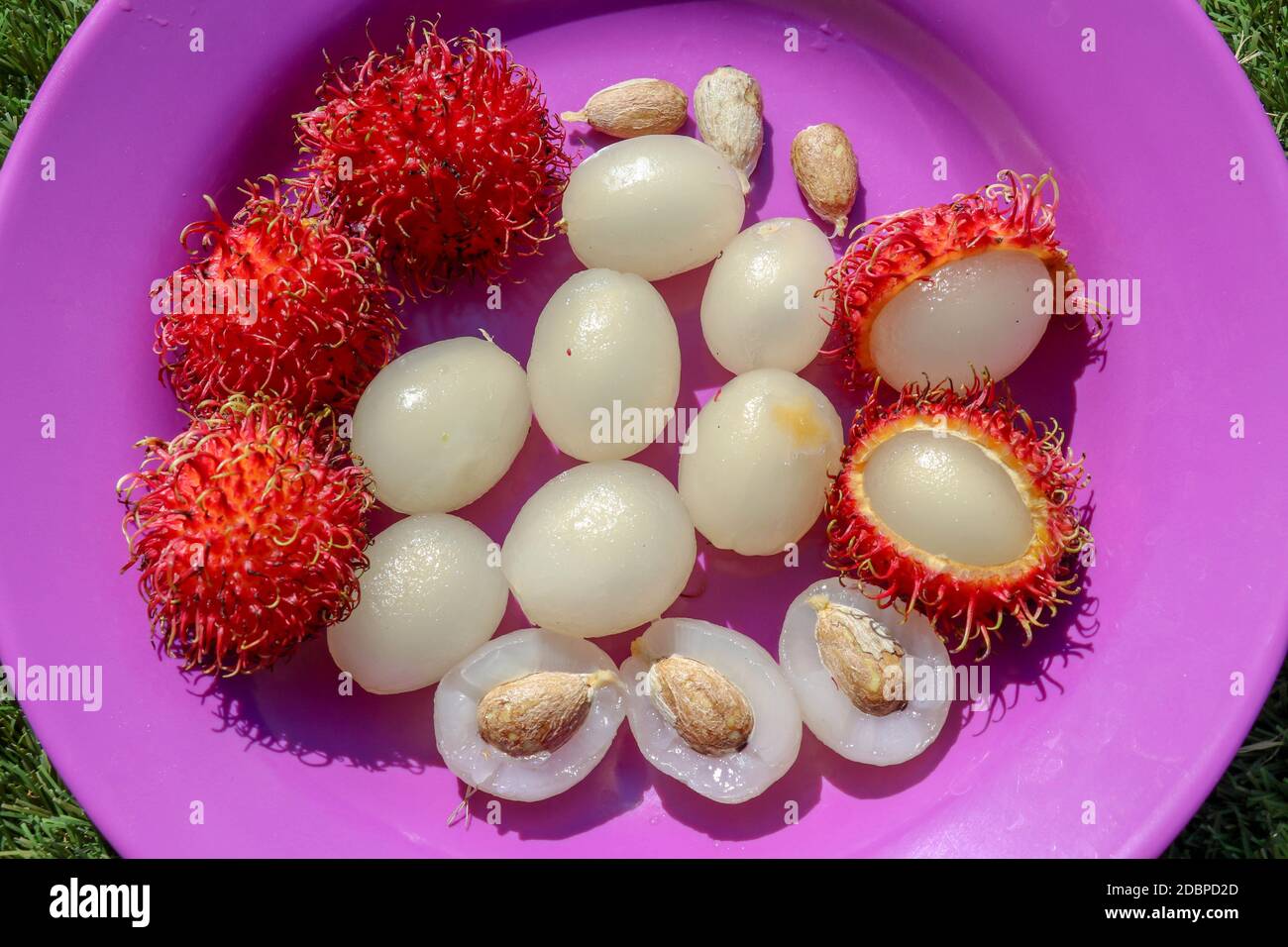 Close up of rambutan, whole and peeled fruits. Top view Healthy fruits ...