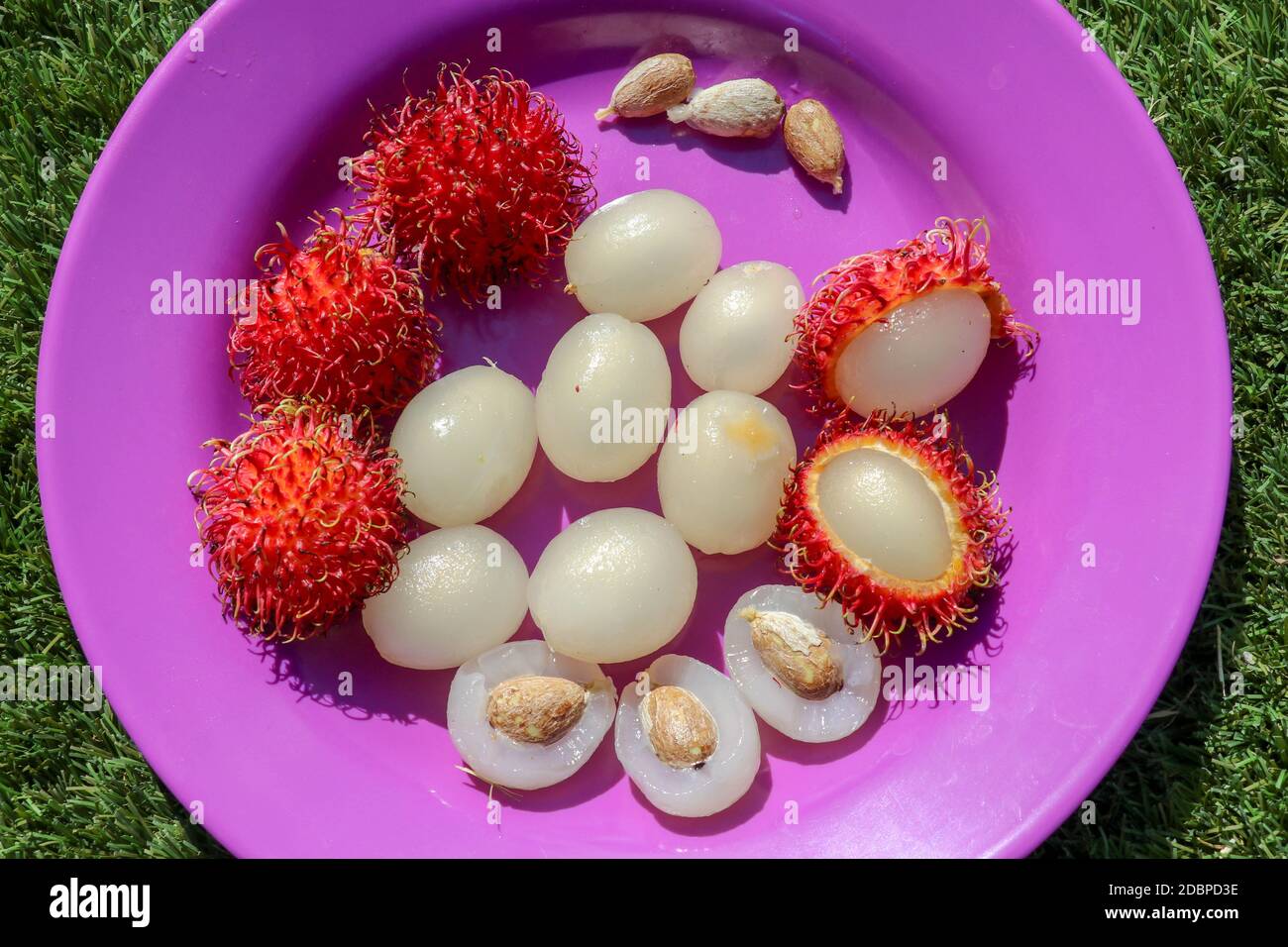 Close up of rambutan, whole and peeled fruits. Top view Healthy fruits ...