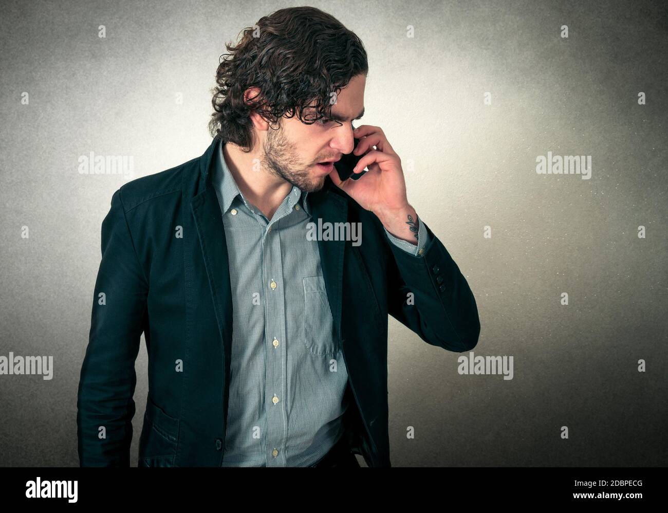 Angry man on the phone Stock Photo - Alamy