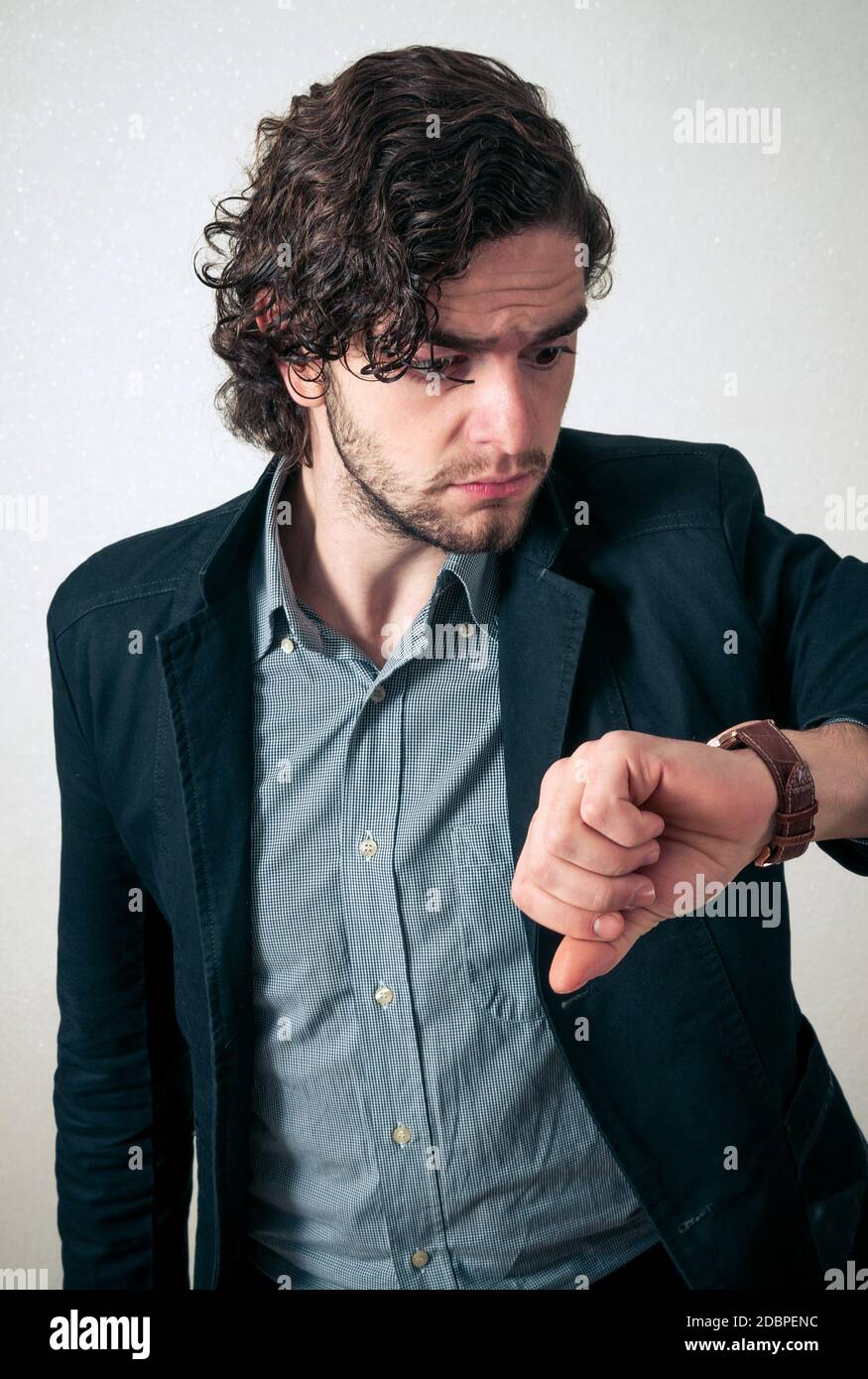 Man looking on the watch Stock Photo - Alamy