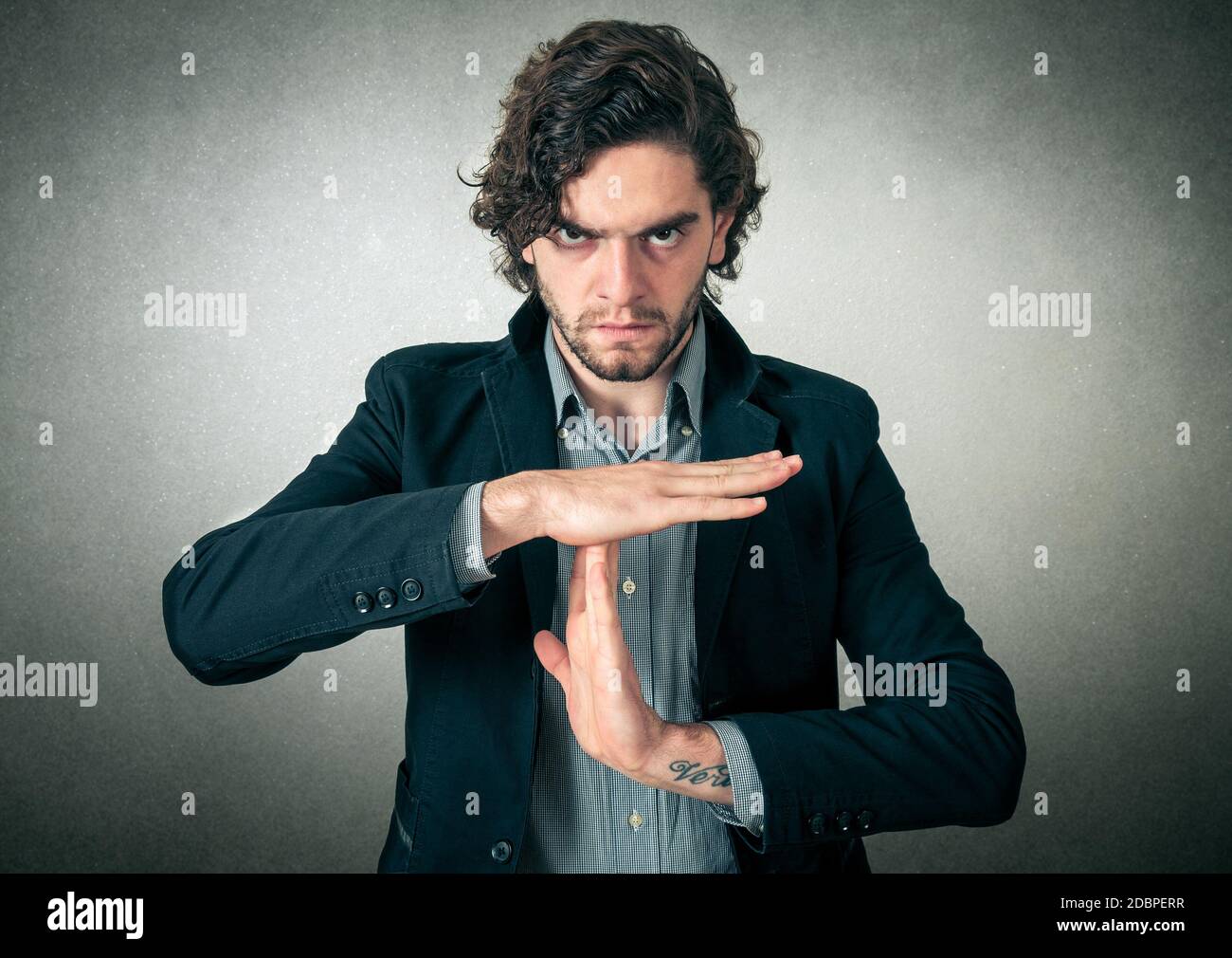 Man making a stop sign Stock Photo - Alamy