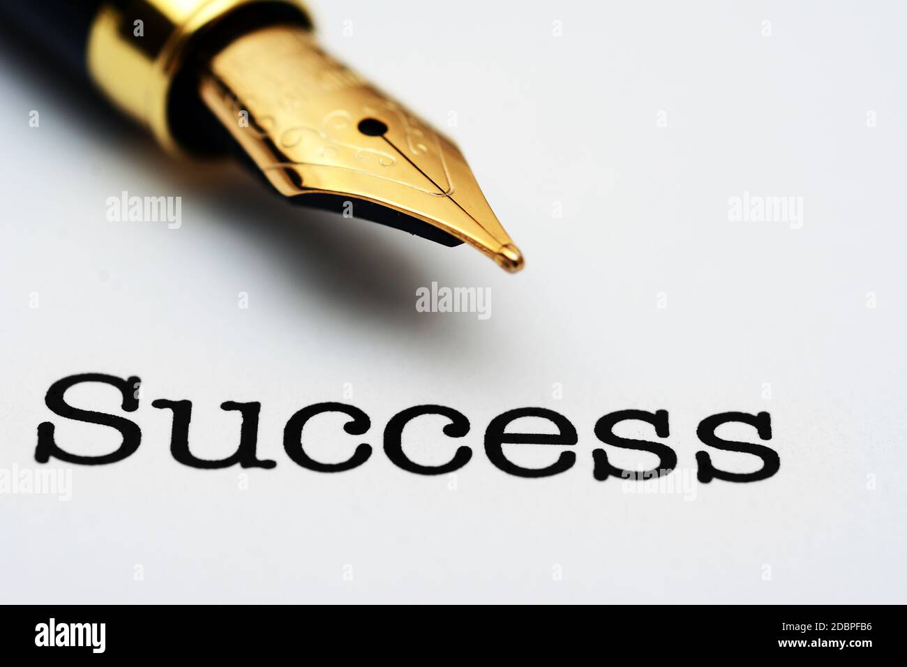 Fountain pen on success text Stock Photo - Alamy
