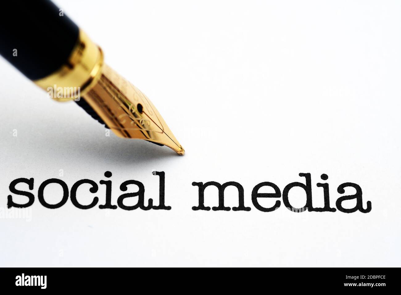Pen on social media text Stock Photo - Alamy