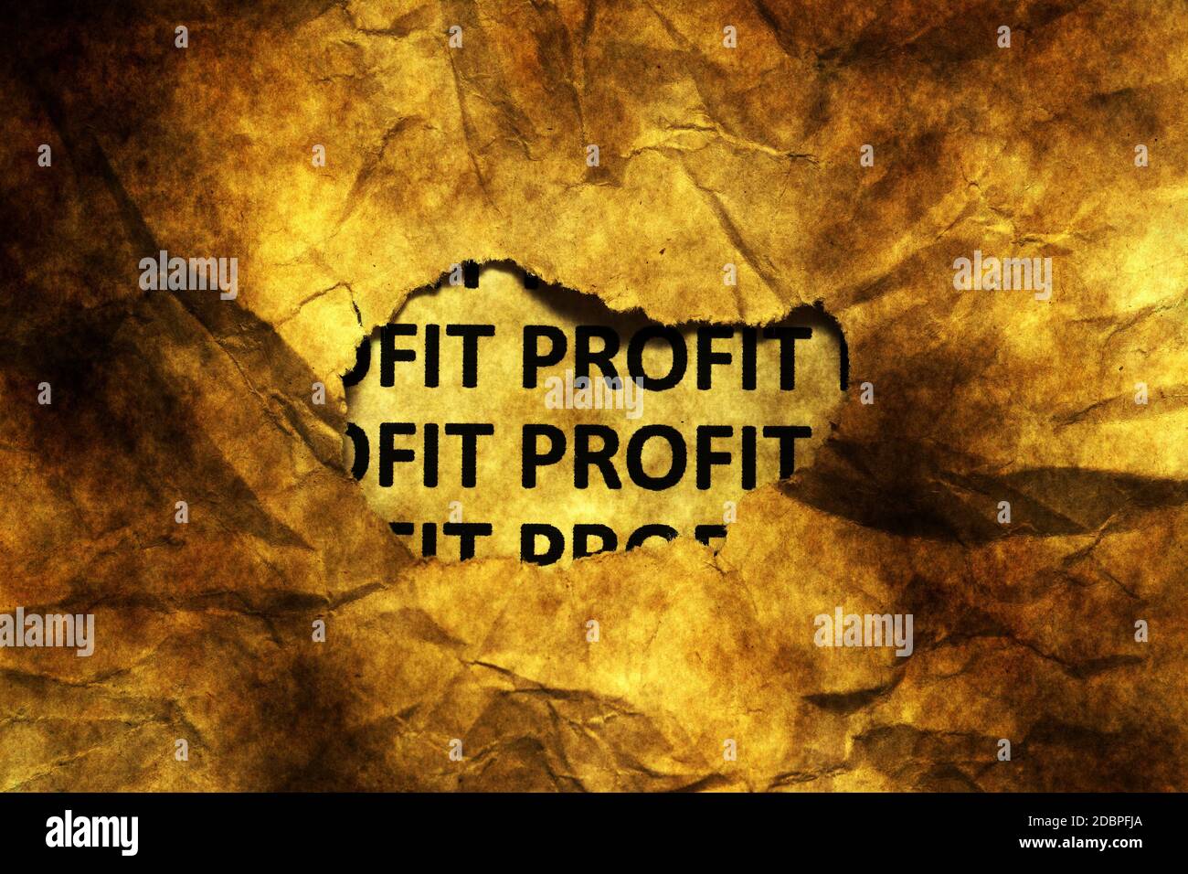 Profit text on paper hole Stock Photo - Alamy