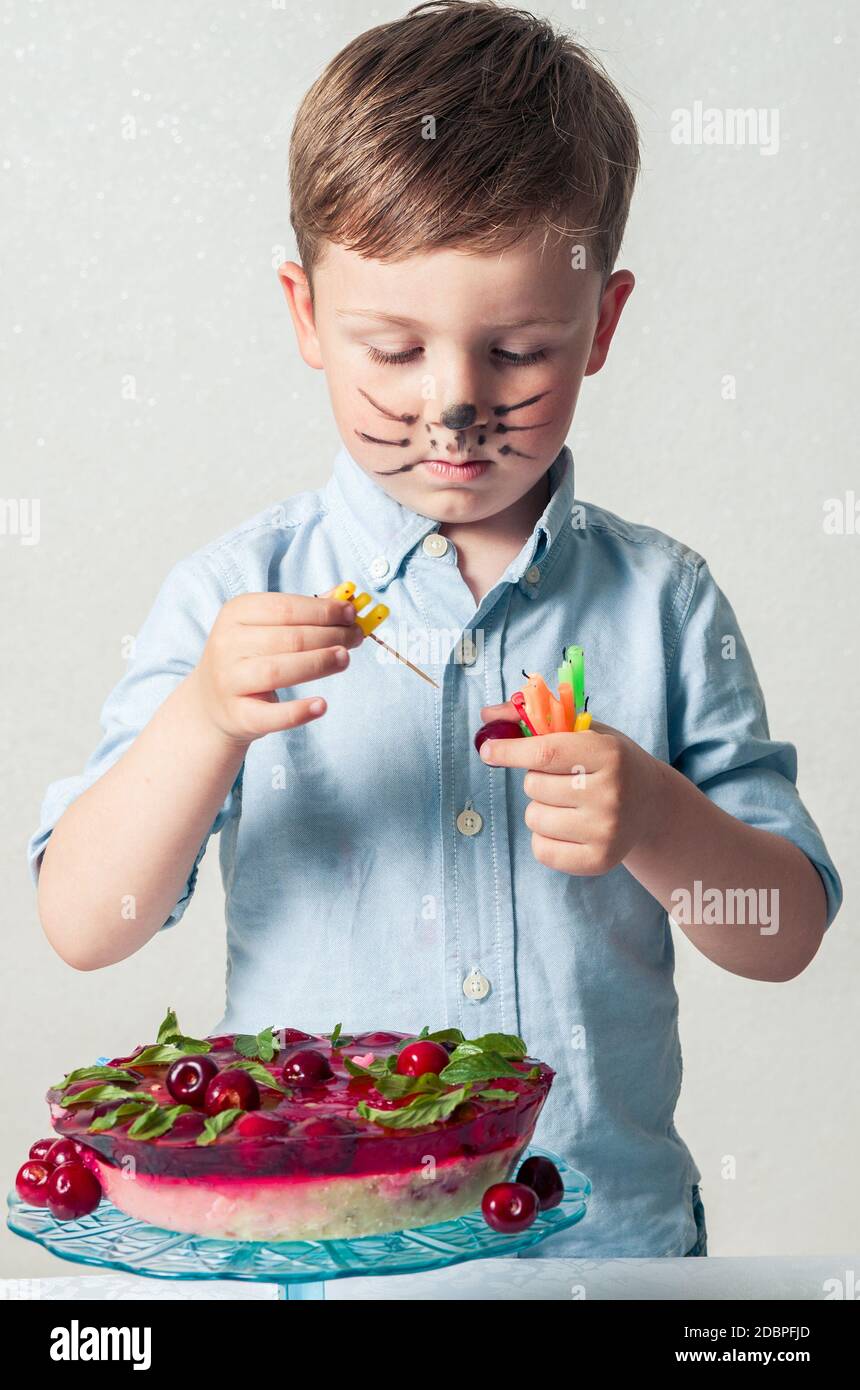 Little boy with the birthday cake Stock Photo - Alamy