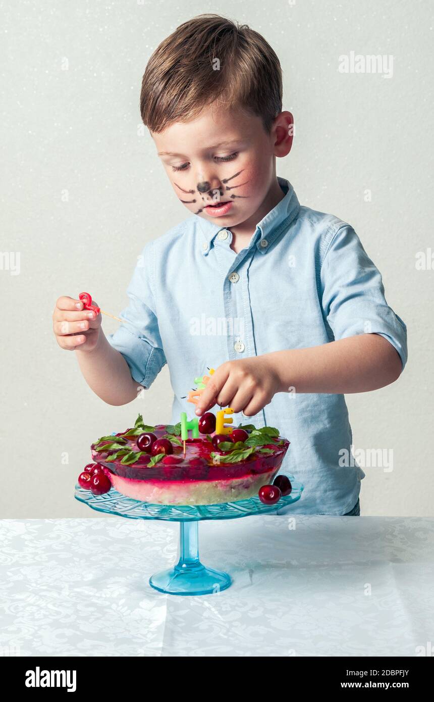 Little boy with the birthday cake Stock Photo - Alamy