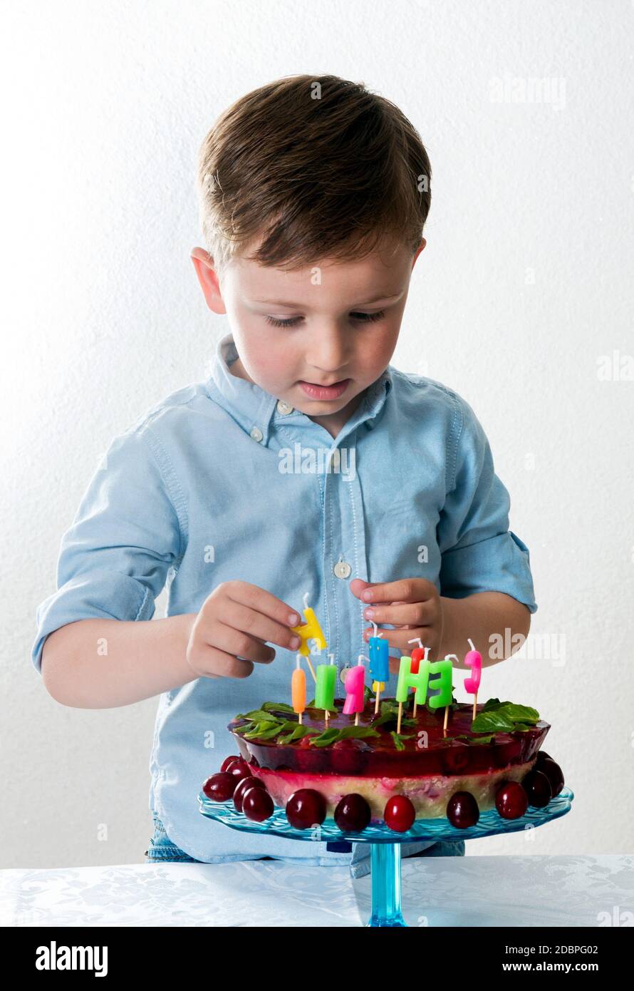Little boy with the birthday cake Stock Photo - Alamy