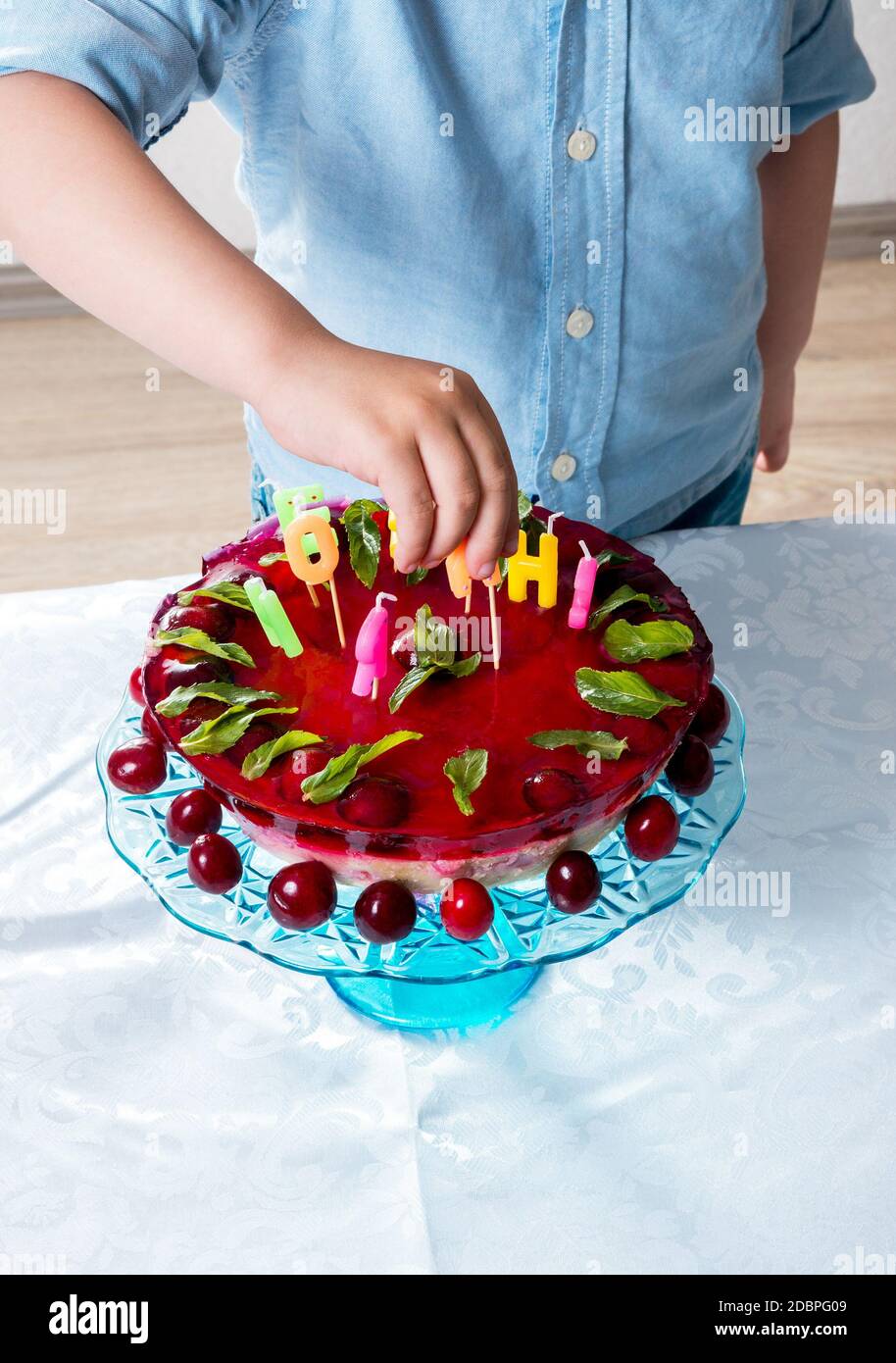 Little boy with the birthday cake Stock Photo - Alamy