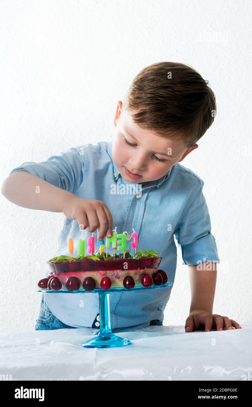 Little boy with the birthday cake Stock Photo - Alamy