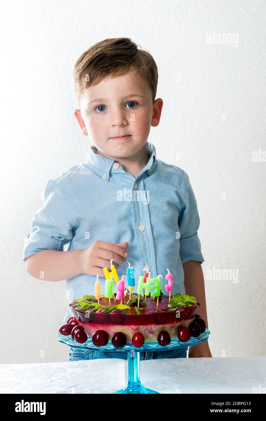 Little boy with the birthday cake Stock Photo - Alamy