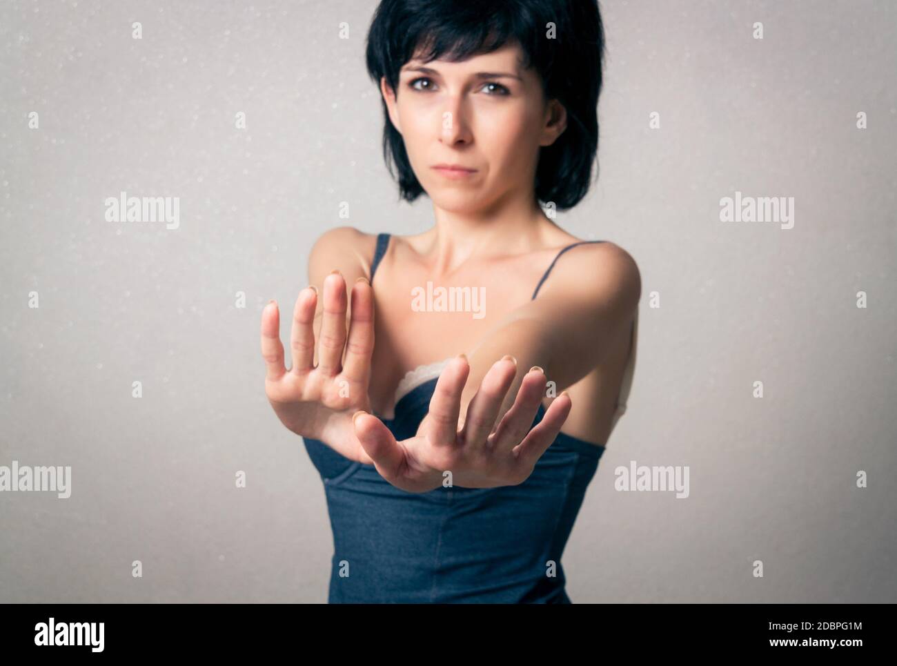 Woman making stop sign Stock Photo - Alamy
