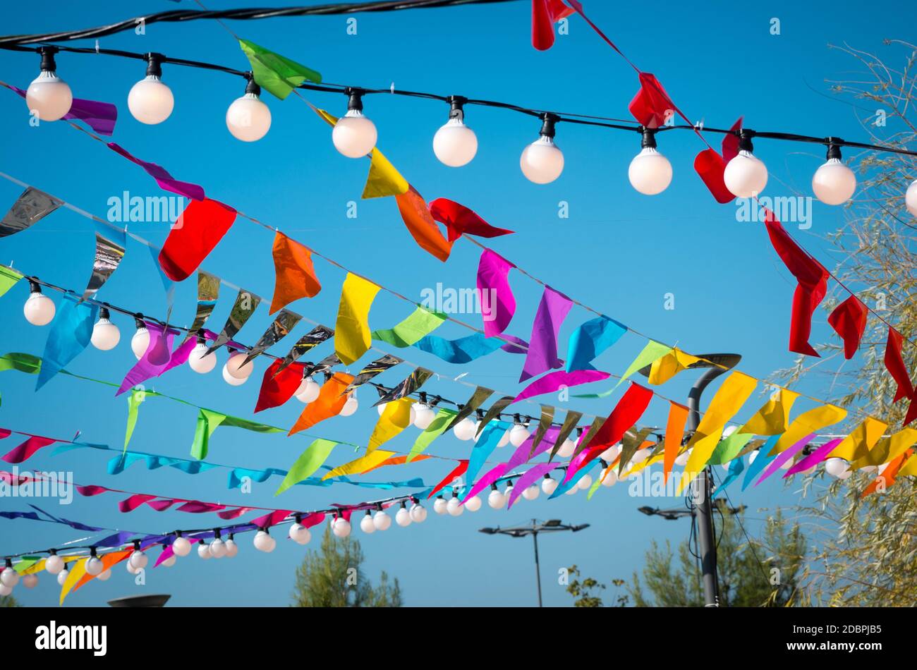 Colorful flags and lamps during celebrations Stock Photo - Alamy