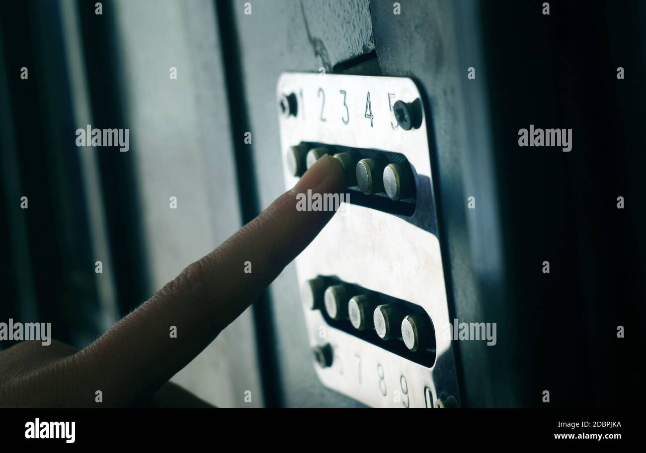 Applying security code on the door Stock Photo - Alamy