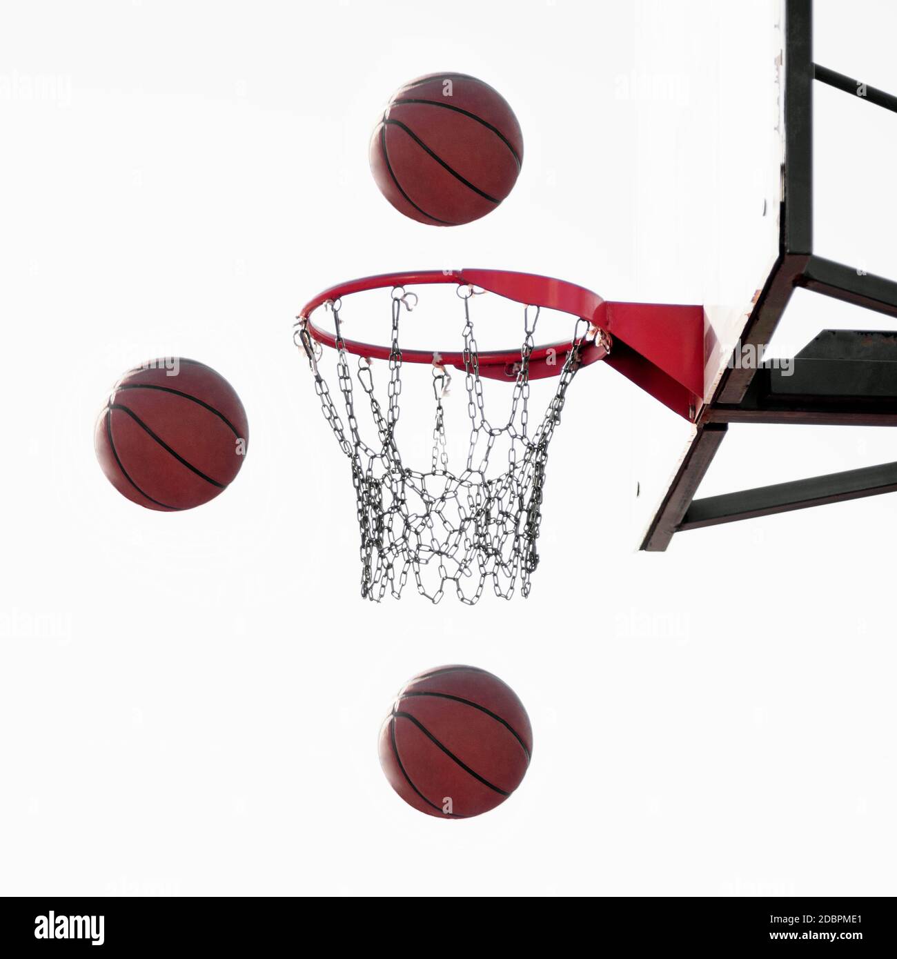 Three basketball balls are flying in the air to basket on white ...