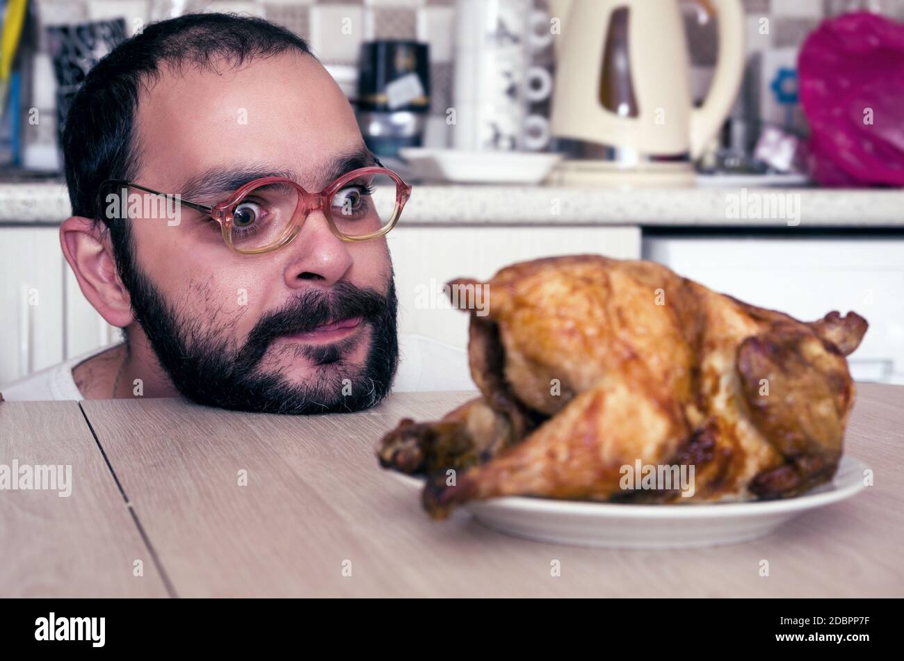 Funny man eating chicken hi-res stock photography and images - Alamy