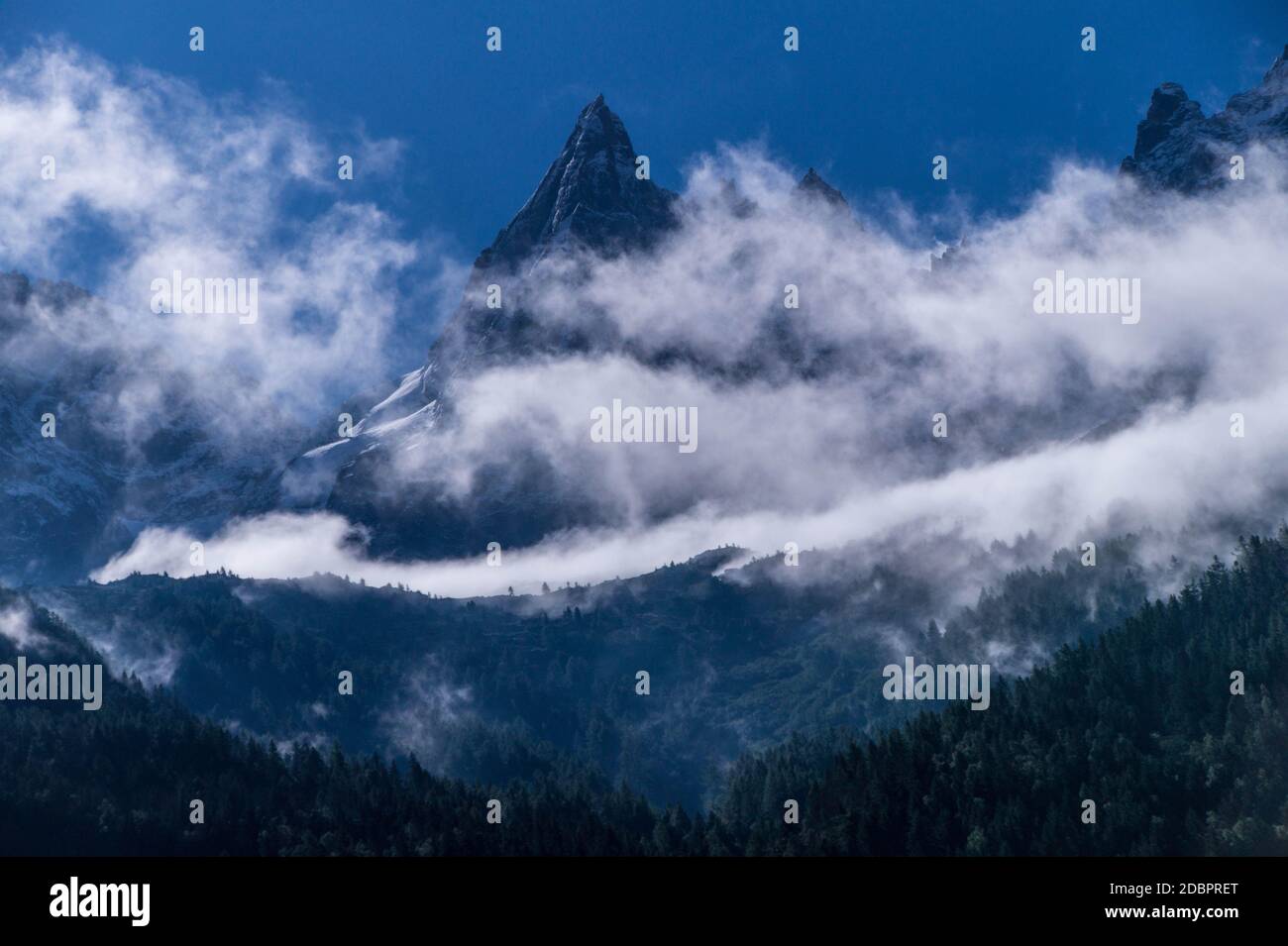 Chamonix needle with fog in the French Alps Stock Photo - Alamy