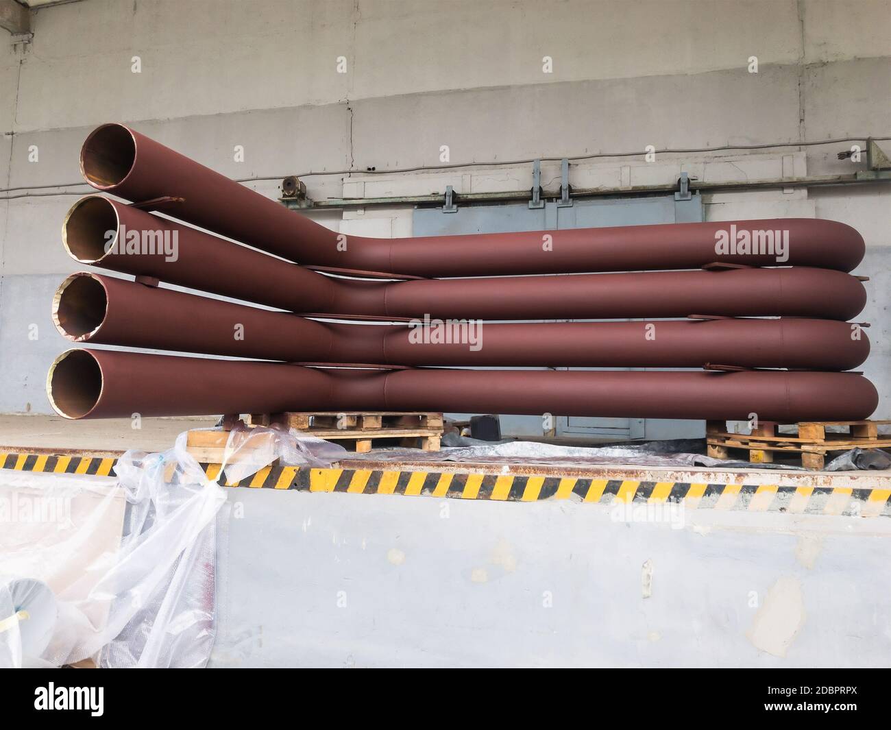 U-shaped brown metal pipe assembly with expansion joints Stock Photo ...